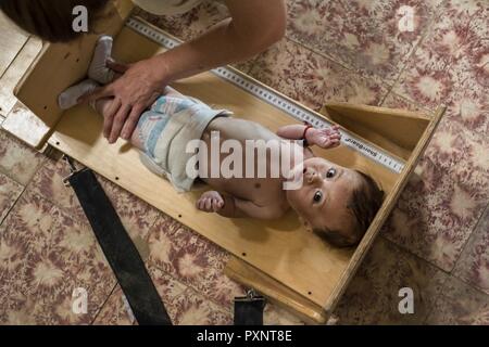 U.S. Army LTC Rhonda Dyer performs anthropometric measurements on a ...