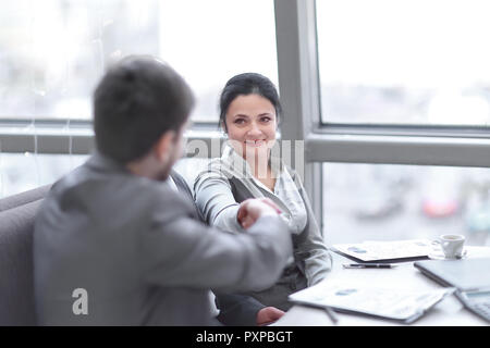close up. handshake of trading partners at the negotiating table Stock ...