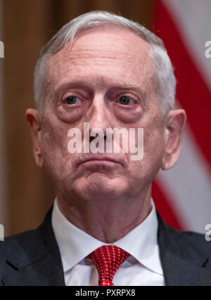 President Donald Trump listens to Defense Secretary Pete Hegseth during ...