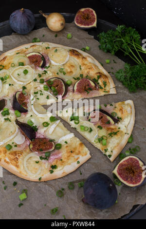 Homemade Tarte Flambee with figs, spring onions and goat cheese Stock ...