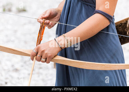 Close up of human hand with arrow icon on blue background Stock Photo ...
