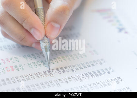Hand write on Various financial charts on the table Stock Photo - Alamy