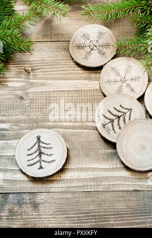 Christmas or New Year homemade pyrography toys. Wooden slice ...