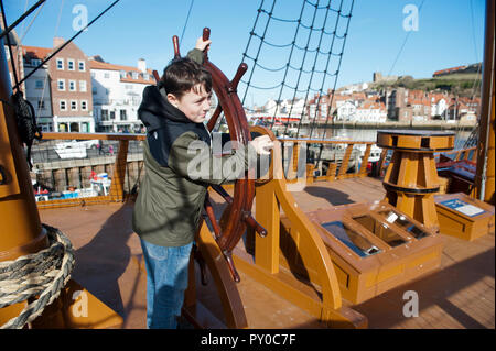 A full scale replica of HM Bark Endeavour being lifted past the Tees ...