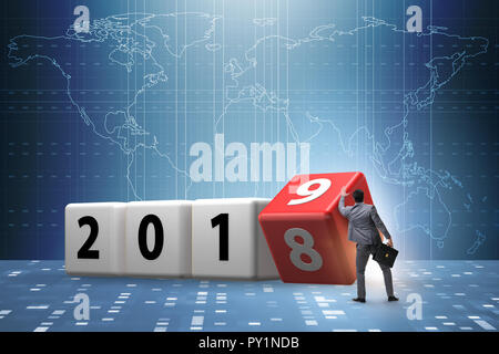Businessman employee rotating cube to reveal number 2019 Stock Photo ...