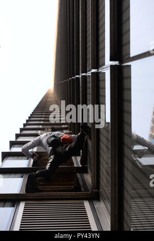 French climber Alain Robert scales the tallest tower of France, the-231 ...
