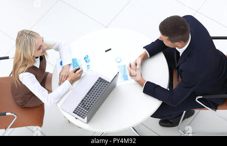 two employees discussing financial charts Stock Photo - Alamy