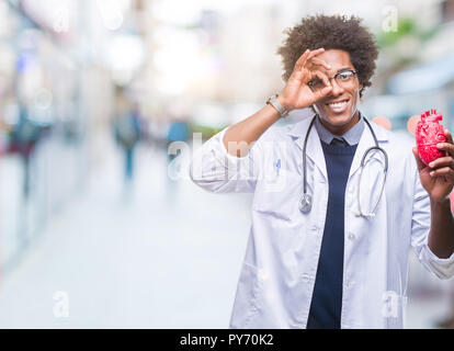Afro american cardiologist doctor man over isolated background doing ok ...