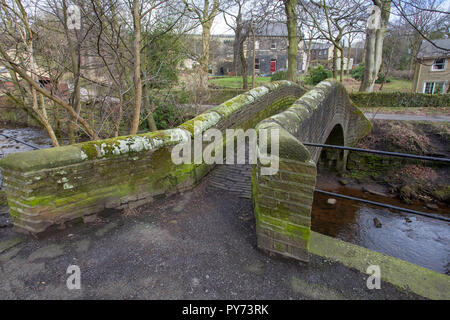 Mellor Bridge, an old packhorse bridge over the River Colne in Marsden ...