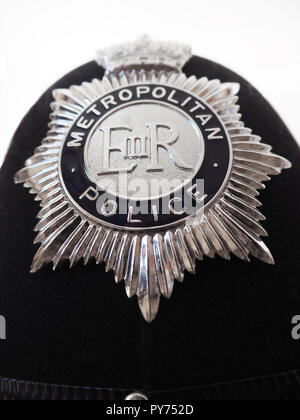 Metropolitan police constable helmet and badge with Saint Paul's ...