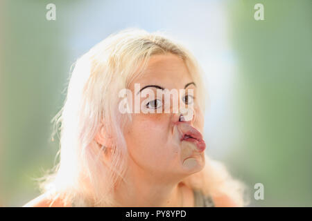 female face pressed against glass or window, funny female face ...