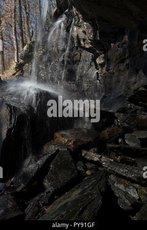 A waterfall is a place where water flows over a vertical drop or a ...