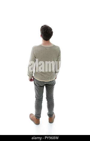 modern young man looks confidently forward. Photo in full length Stock ...