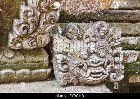Stone carved demon Kala in Balinese Hindu temple Pura Taman Kemuda ...