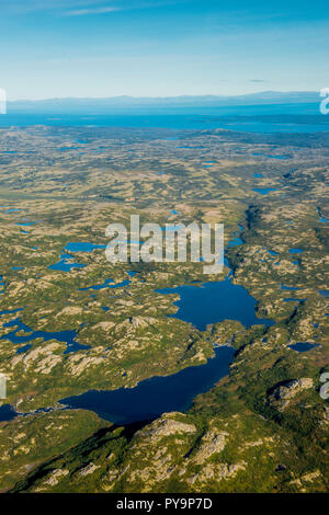 Aerial view of Lake Iliamna and the Alaska Range in early summer ...