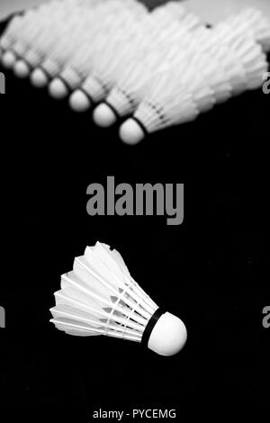 White shuttlecock isolated on black background. Image can be used as ...