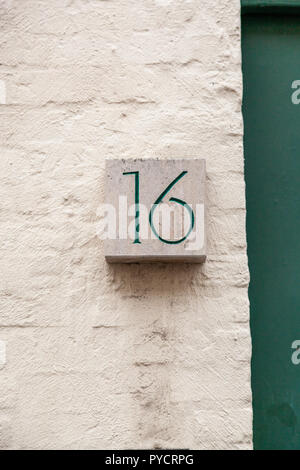 House number 16 painted sign on wall Stock Photo - Alamy