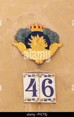 House Number 46 sign on wall painted white Stock Photo - Alamy