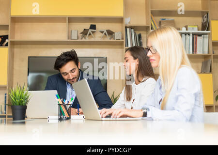 Cheerfull business team working together to achieve better results ...