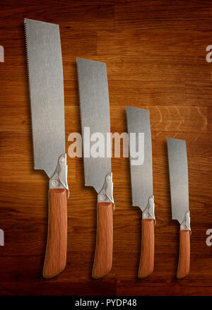 A craftsman saws a wooden board on a circular saw. Making furniture ...