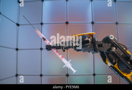Robotic hand holding syringe Stock Photo - Alamy