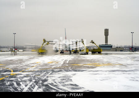 Planes are lining up on the snowy runway in Toronto airport (YYZ), the ...