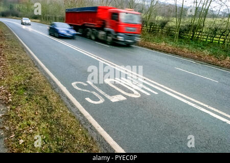 Double red line road markings on a UK road Stock Photo - Alamy
