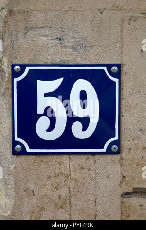 Fifty-Nine Number Sign on Stone Wall Stock Photo - Alamy