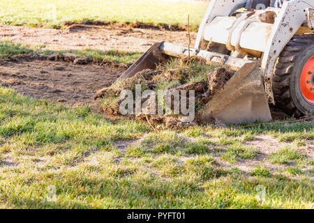 Small Bulldozer Removing Grass From Yard Preparing For Pool ...