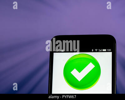 approved symbol logo seen displayed on smart phone Stock Photo - Alamy