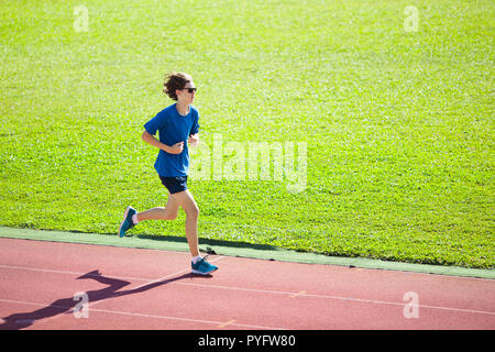 Teenager school kids running Stock Photo - Alamy