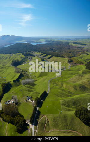 An aerial view of lush, verdant hills, with a patchwork of different ...