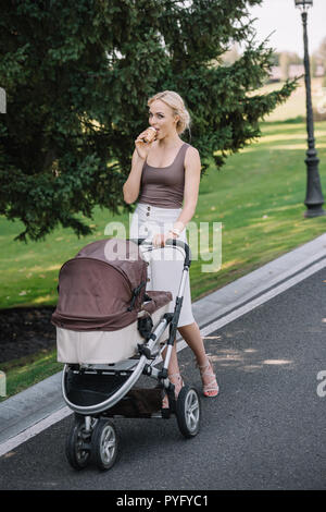 Child with ice cream in the stroller Stock Photo - Alamy
