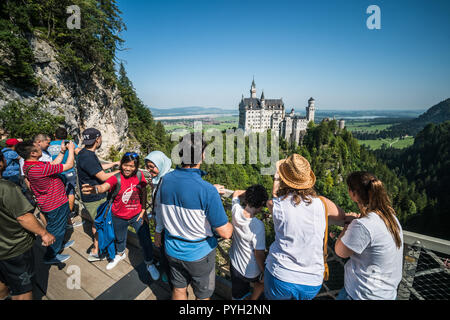 Tourists at the viewpoint on Neuschwanstein, Germany, Europe Stock ...