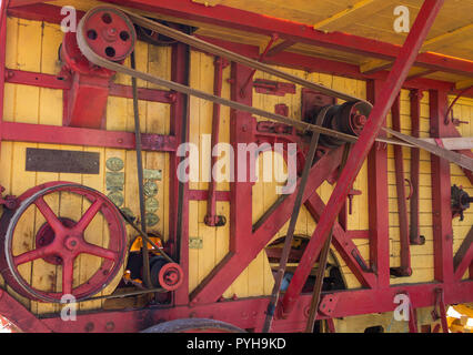 leather drive belts and pulley system on a vintage threshing machine ...