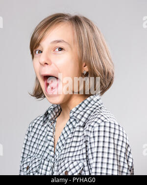 Little girl, silly and goofy face on green screen with facial ...