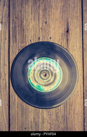 Vintage scratched gramophone record with a blue label Stock Photo - Alamy