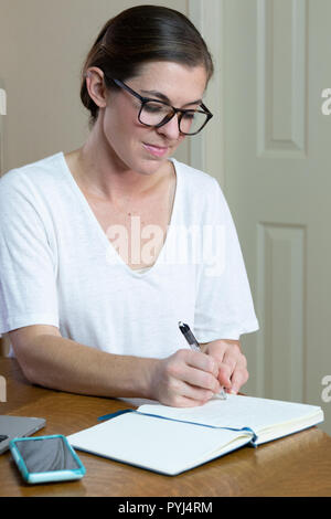 Serious woman looking intently to the side with a thoughtful expression ...