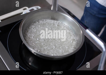 sugar water boiling to make syrup Stock Photo - Alamy