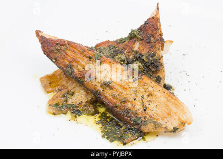 Sections of ray wings from an Undulate ray, Raja undulata, frying in ...