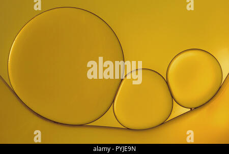 Macro photo of an oil drops on water surface looks like tissue under ...