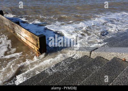 Concrete stepped revetment, coastal flood defences, leading to cafe ...