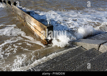 Concrete stepped revetment, coastal flood defences, leading to cafe ...