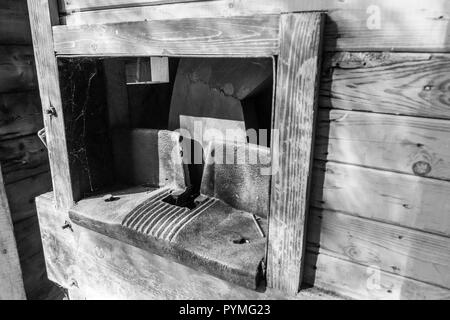 Antique wood splitter or chopper in an old Swedish farm in northern ...