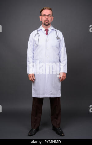 Blond bearded man doctor with goatee against gray background Stock ...