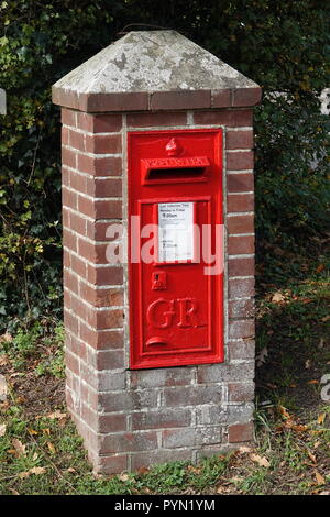 Royal Mail bright red post box with gold painted E R and Royal Crest ...