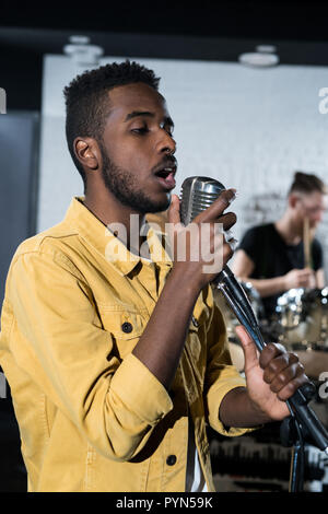 African american man artist singing song at music studio Stock Photo ...
