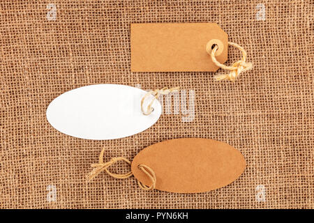 Blank labels on burlap background Stock Photo - Alamy