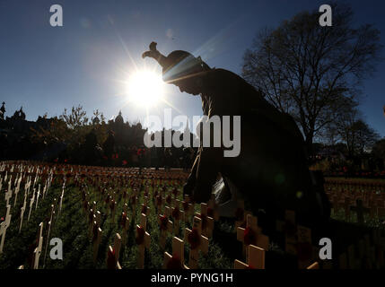 Captain Gary Rattray from 2 Scots Royal Regiment of Scotland lays a ...