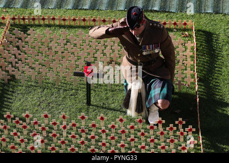 Captain Gary Rattray from 2 Scots Royal Regiment of Scotland lays a ...